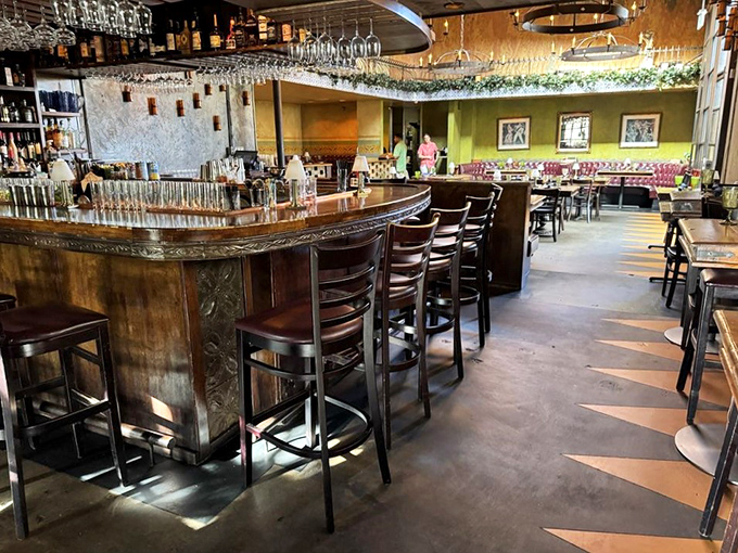 A well-stocked bar with overhead glassware storage means they're serious about cocktails and creating the right drinking atmosphere here.