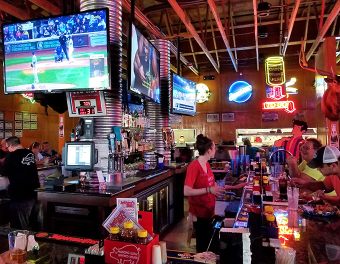 The bar area&mdash;where sports fans gather to witness two spectacles: the game on screen and the parade of barbecue heading to tables.