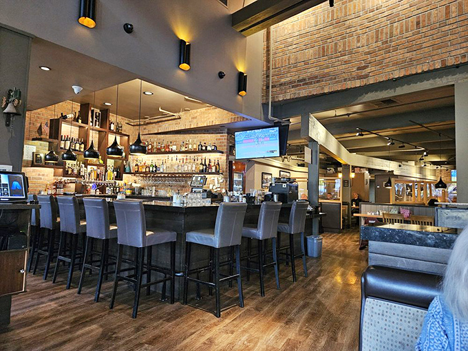 The bar area strikes that perfect balance between sophisticated and approachable—where both wine aficionados and beer enthusiasts find common ground.