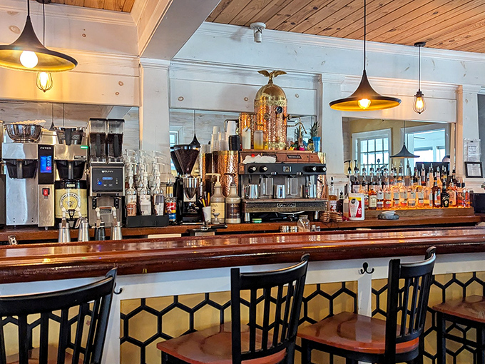 The bar area combines rustic charm with mixology magic. Those pendant lights create the perfect glow for both Instagram photos and morning coffee contemplation.
