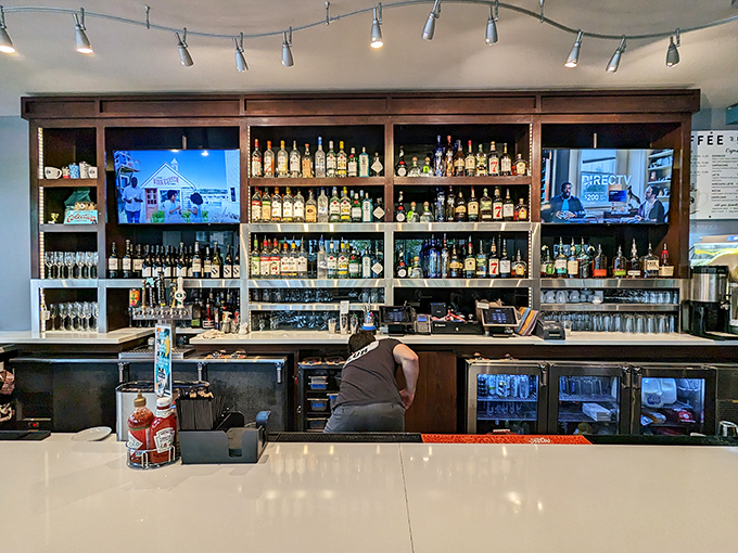 The bar at Bassett Street doesn't just serve drinks – it serves possibilities, all lined up in bottles waiting to enhance your brunch experience.