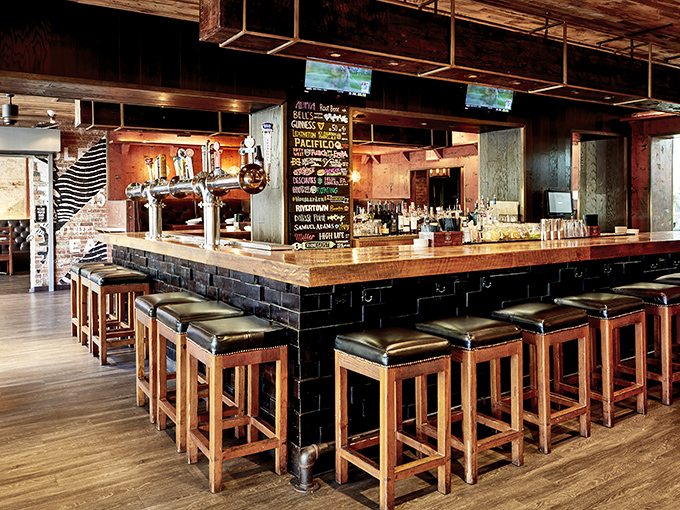 A bar built for lingering, where craft beers flow and strangers become friends over shared plates of southern comfort classics.