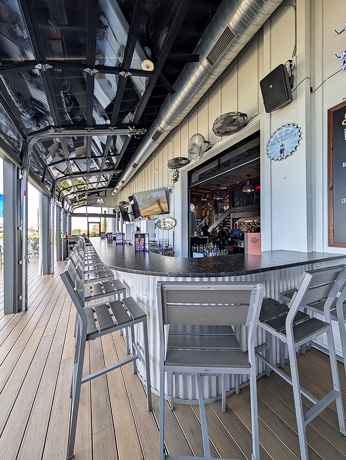 Indoor-outdoor living at its finest with a corrugated metal bar that brings industrial chic to waterfront dining. The perfect spot for a cold craft beer.