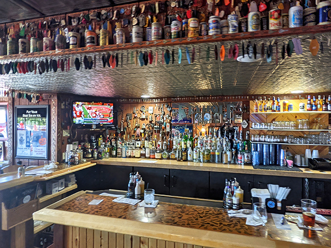 A bar that doesn't need gimmicks—just cold drinks, good company, and enough character to fill Lake Huron. Note the collection of colorful flip-flops above.