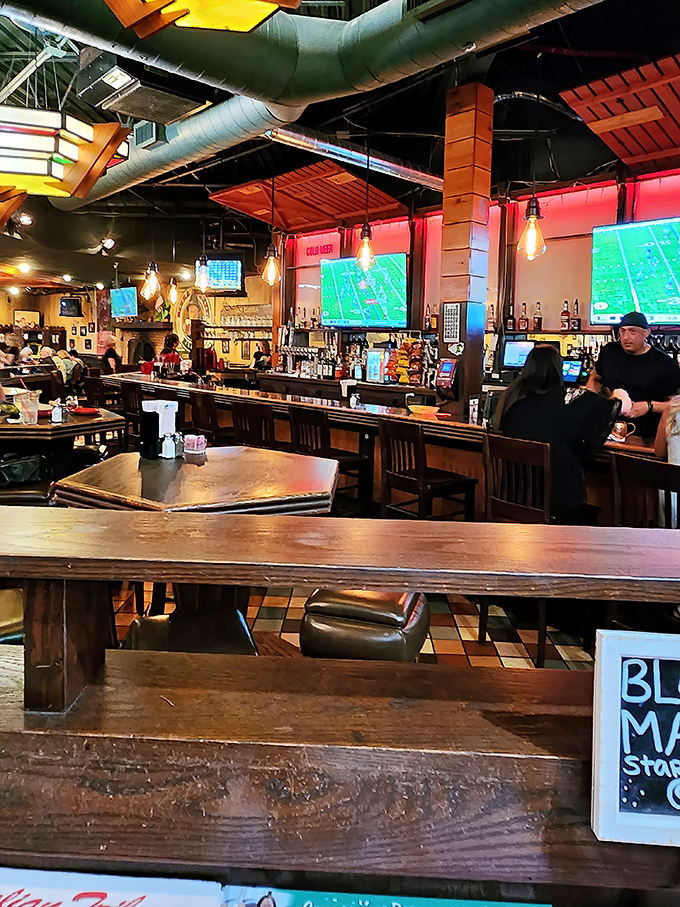 The bar area: where strangers become friends over shared pizza appreciation and sports commentary.