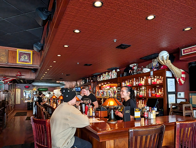 The bar area buzzes with conversation, where strangers become friends over shared appreciation of craft beer and burger artistry.