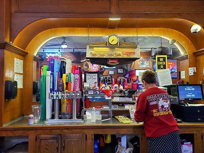 The bar area &ndash; where Oklahoma sports memorabilia meets cold drinks. This is command central for the chicken operation that's kept locals happy for generations.