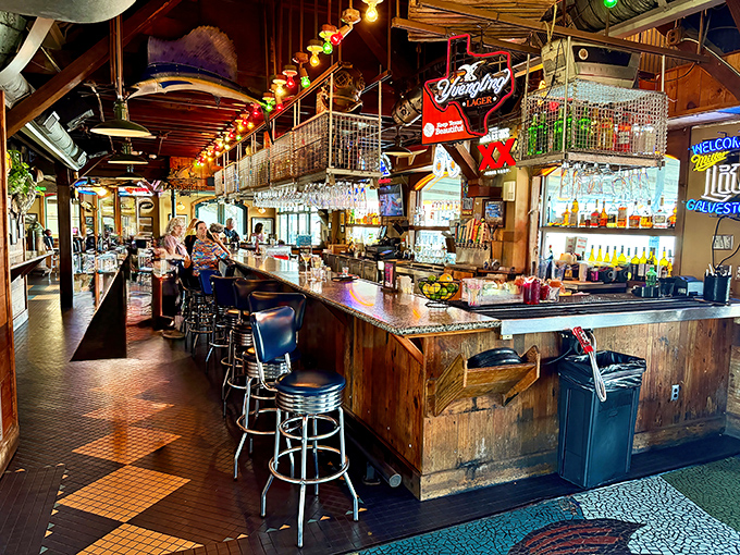 The lively bar area where cold beer flows as freely as the fish tales and laughter.