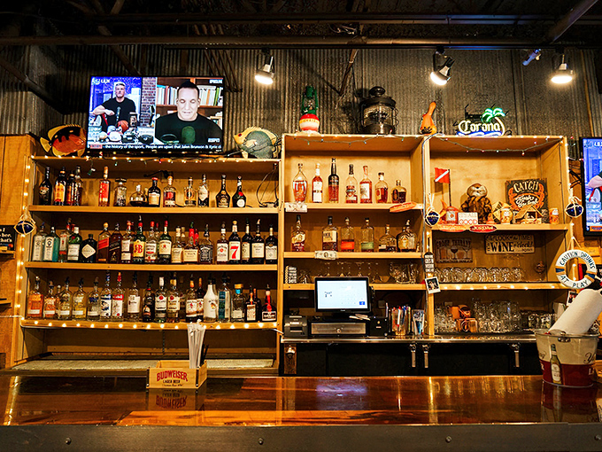 The bar shelves tell tales of tropical escapes and maritime adventures. Each bottle stands ready to complement your seafood journey.