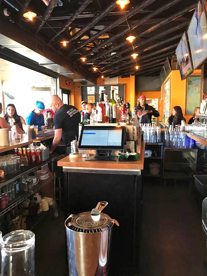 The bar area buzzes with activity &ndash; because nothing complements smoked meats quite like a cold beverage and sports on multiple screens.