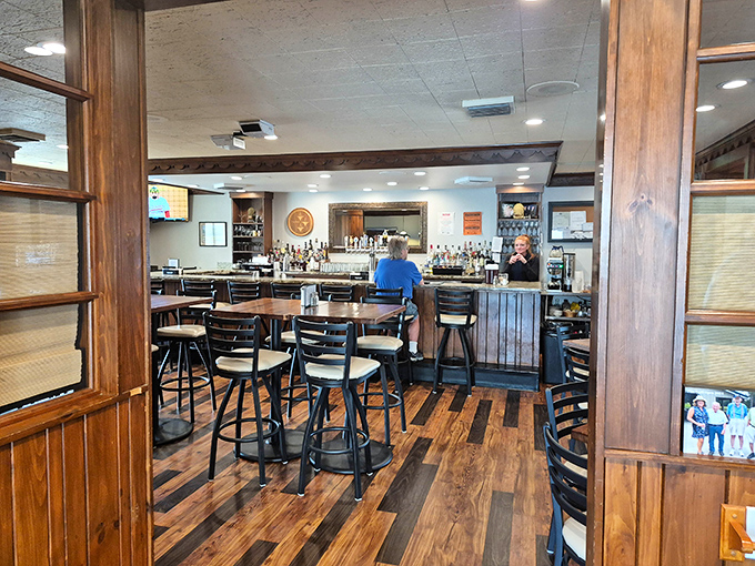 The bar area combines classic wood elements with modern touches—a perfect metaphor for Pine Grill's enduring appeal.
