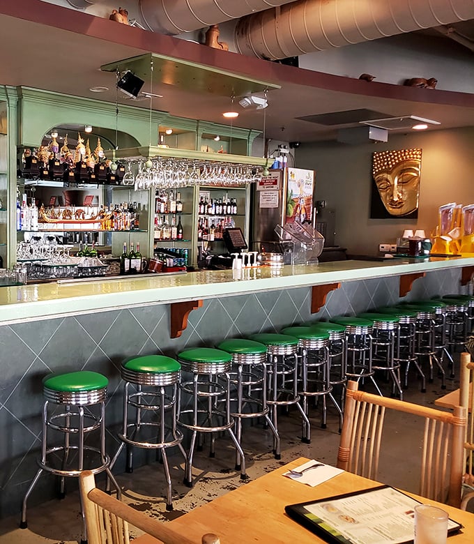 The bar area isn't just serving drinks&mdash;it's creating liquid companions for your culinary journey through Thailand, no passport required.