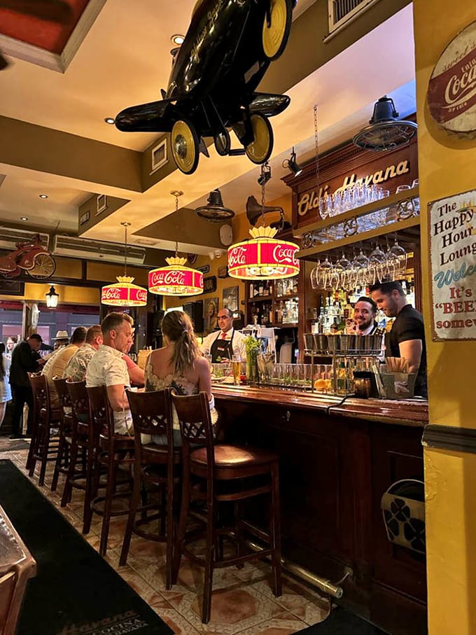 Coca-Cola chandeliers illuminate the bar where magic happens&mdash;one part rum, two parts conversation, and a splash of Cuban hospitality.