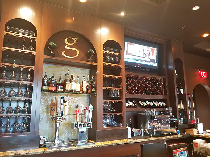The bar area's elegant "g" centerpiece and impressive wine display announce that this isn't just a place to eat&mdash;it's a place to linger and savor life's pleasures.
