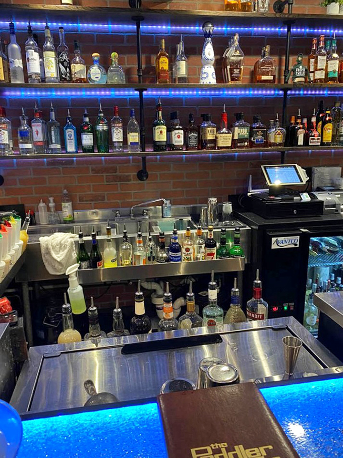 The bar glows like a bourbon lover's jewelry box, with bottles lined up like liquid soldiers.