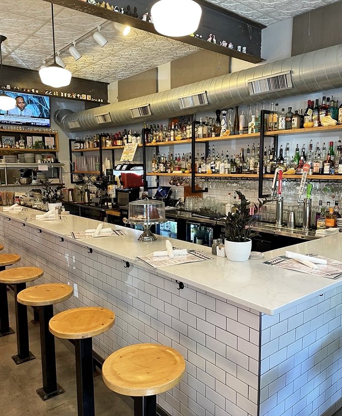 A bar stocked like a liquid library, where every bottle tells a story and the bartenders know all the best chapters.