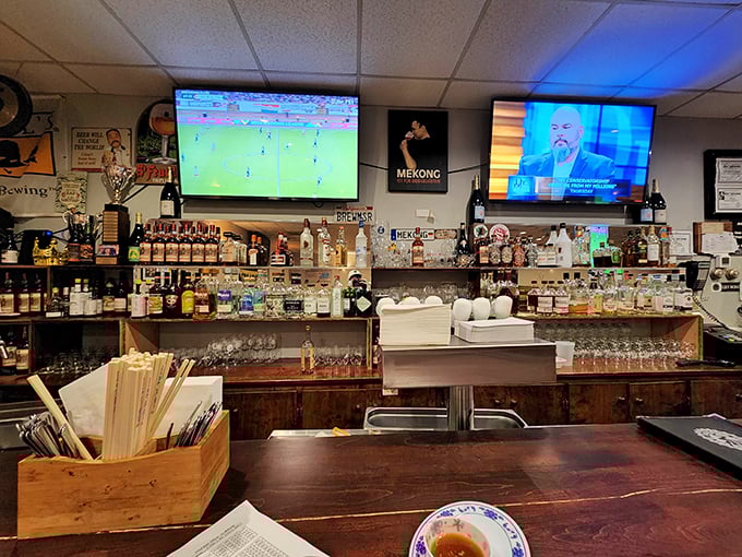 A beer lover's paradise hiding behind a Vietnamese restaurant. The chalkboard menu hints at liquid treasures waiting to be discovered.