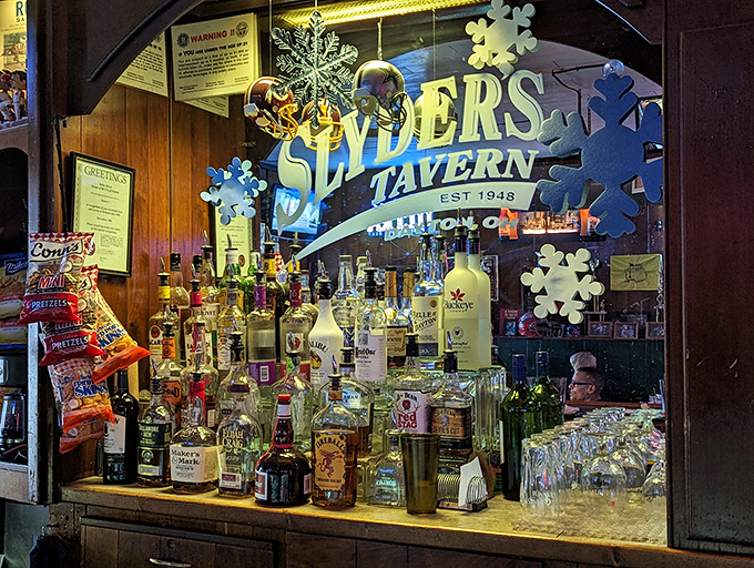 The bar area glows with the warm amber promise of good drinks and better conversation, bottles standing at attention like loyal soldiers.