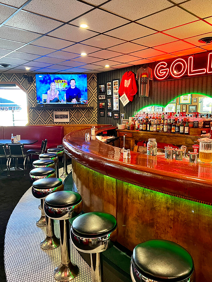 The curved bar invites you to pull up a stool and settle in&mdash;this is where stories are shared and friendships forged over cold drinks.