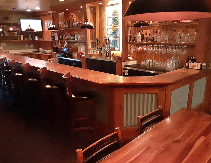 A bar that invites you to pull up a stool and stay awhile. The warm wood tones practically radiate hospitality.