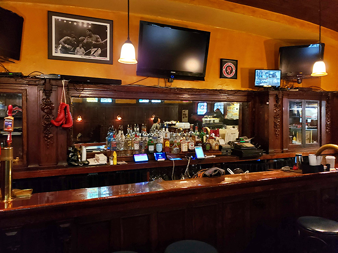 The bar area balances warmth and character, with boxing memorabilia that tells stories without saying a word. A perfect perch for solo diners.
