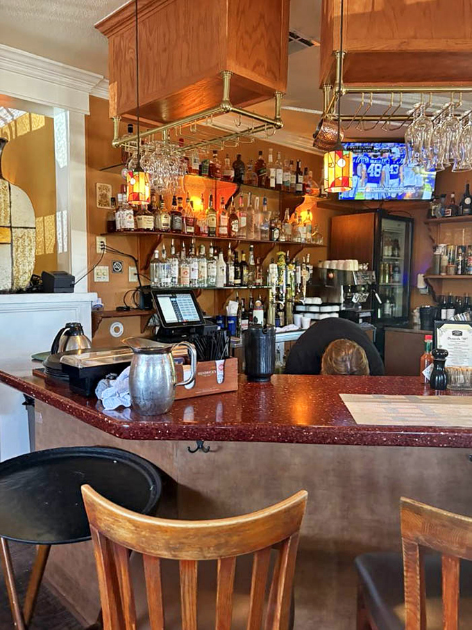 The well-stocked bar hints at brunch cocktail possibilities, where morning libations are crafted with the same care as the kitchen's culinary creations.