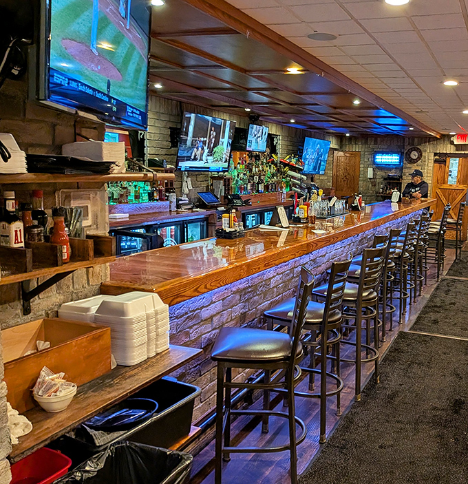 The bar area balances sports-watching practicality with genuine warmth. Where everybody might not know your name yet, but they're happy to learn it.