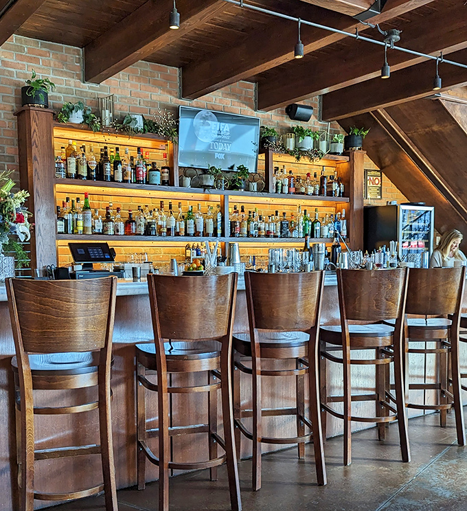 The bar isn't just stocked&mdash;it's curated. Wooden stools invite you to settle in for an evening of liquid artistry and neighborly conversation.