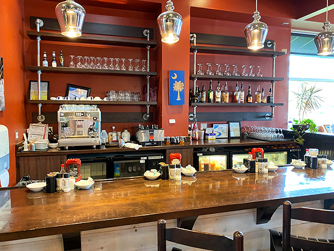 The bar area showcases South Carolina pride with that palmetto flag. Morning mimosas and Bloody Marys await those ready to elevate breakfast.