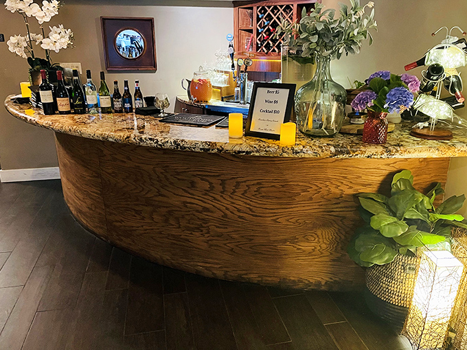 The bar's curved elegance invites you to linger over a pre-dinner Manhattan while flowers and candlelight set the mood for evening magic.