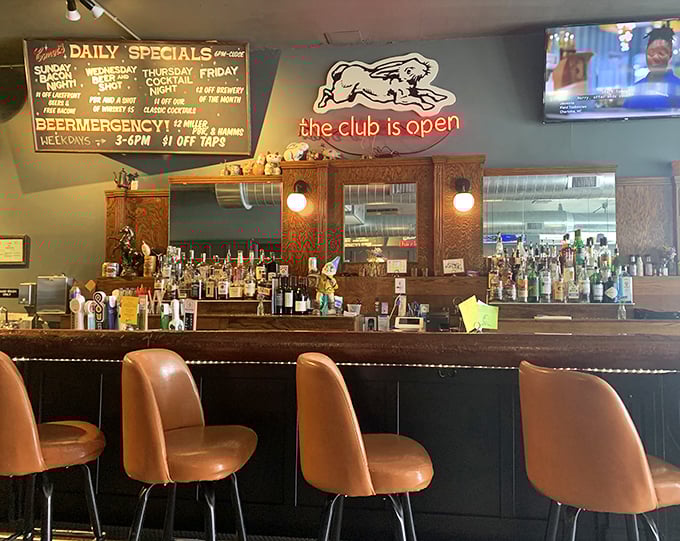 "The club is open" glows above the bar, a neon promise that whatever kind of day you've had, Comet Cafe is ready to make it better.