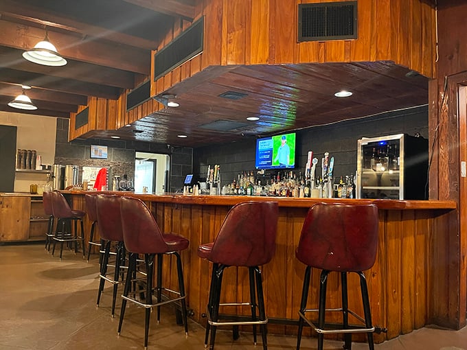 The bar area beckons with wooden warmth and the promise of pre-dinner drinks that set the stage for beef-based bliss.