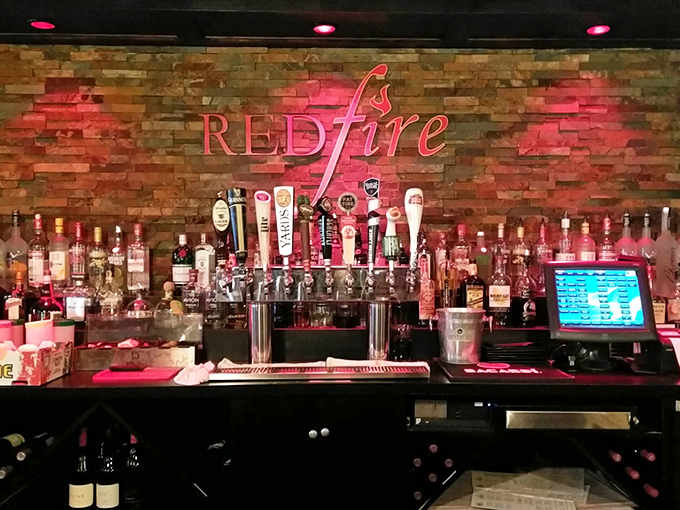 The bar's stone backdrop and glowing bottles create the perfect stage for cocktail magic&mdash;where even a simple gin and tonic feels like a special occasion.