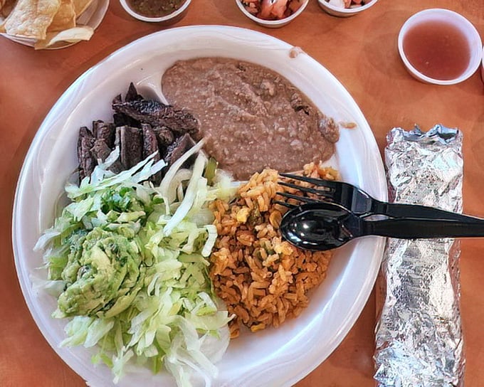 A proper plate of barbacoa with all the fixings. This isn't just a meal; it's a weekend tradition worth setting your alarm for.