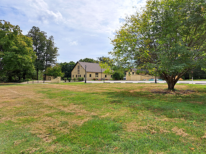 The historic barn sits quietly on the landscape, holding centuries of stories within its walls—if only it could talk.