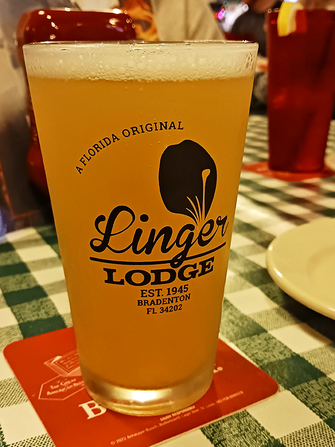 Cold beer in a classic glass &ndash; the perfect companion for swamp cuisine. Nothing cuts through gator tail batter like a crisp, golden Florida brew.