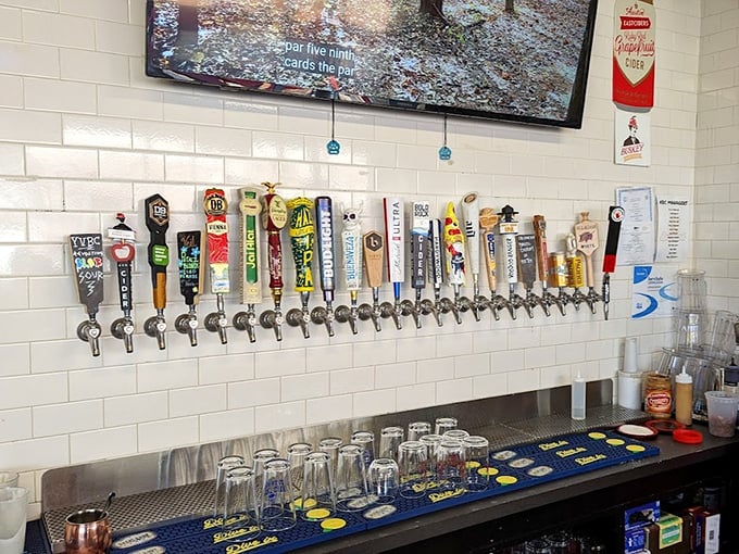 The beer tap wall—a liquid library of hoppy happiness where decisions get harder with each passing minute.