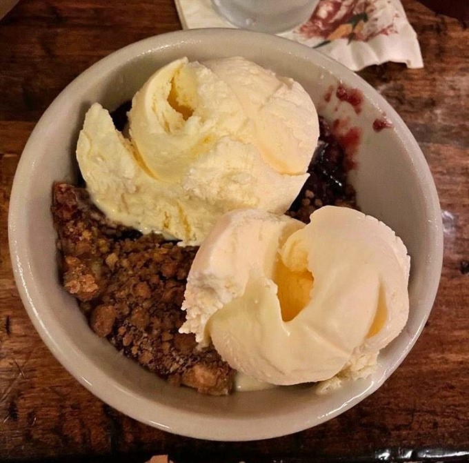 Berry cobbler à la mode – where warm fruit meets cold ice cream in a temperature tango that dances straight to your soul.