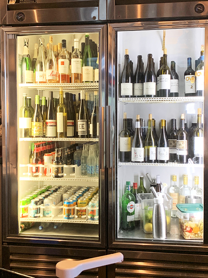 The beverage fridge &ndash; where adult refreshments stand at attention, ready to transform your meal from "delicious" to "I'm never leaving Austin."