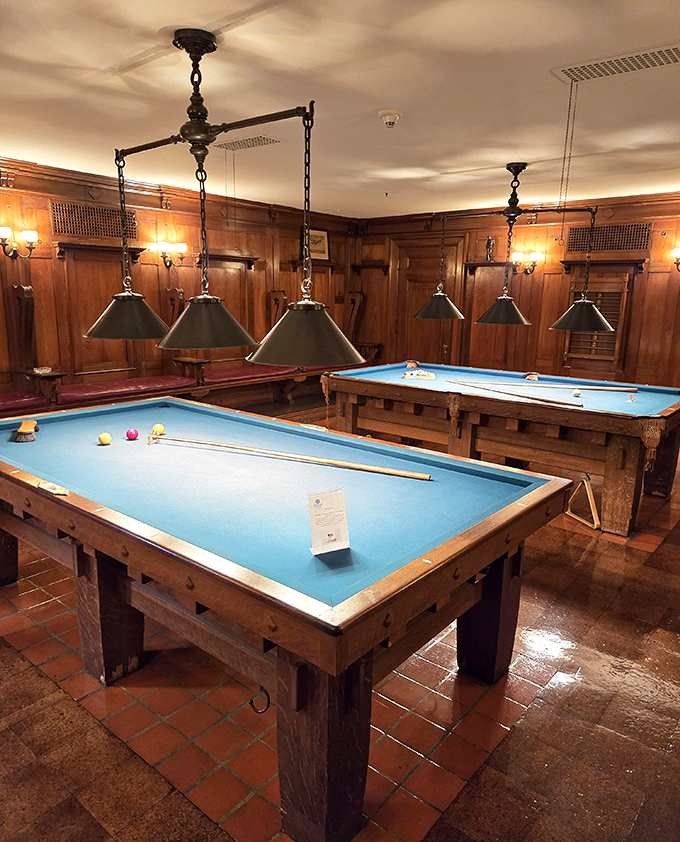 Not your average basement rec room. These billiard tables have probably settled more business deals than most boardrooms.