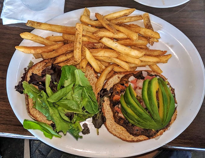 This black bean burger proves meatless doesn't mean flavorless &ndash; topped with fresh avocado like nature's own butter.