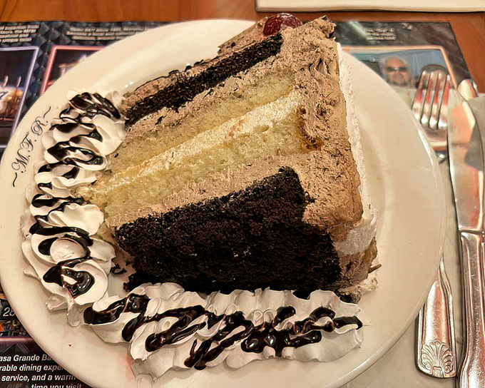 This layered chocolate cake isn't just dessert&mdash;it's architecture, engineering, and art all served on a plate that's barely big enough.