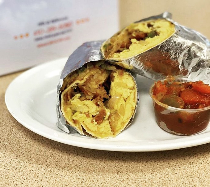 Breakfast burrito perfection: where eggs, potatoes and morning dreams are wrapped in a warm tortilla hug.