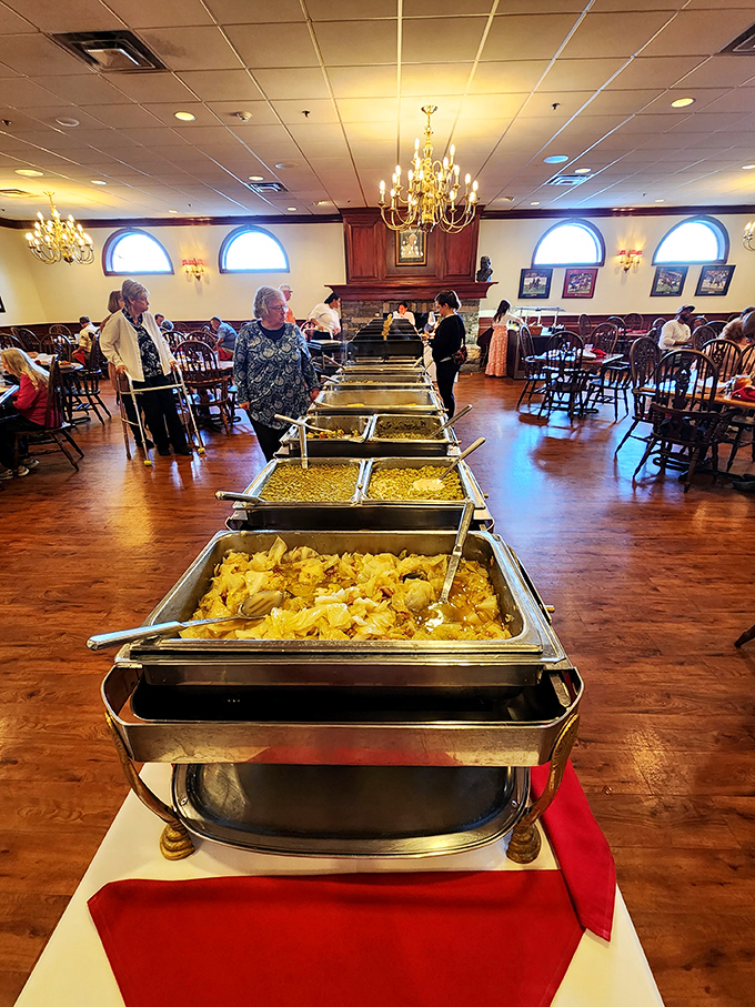 The buffet line stretches like a golden road to comfort food paradise, with steam rising from trays of Southern classics that whisper, "Take a little more."