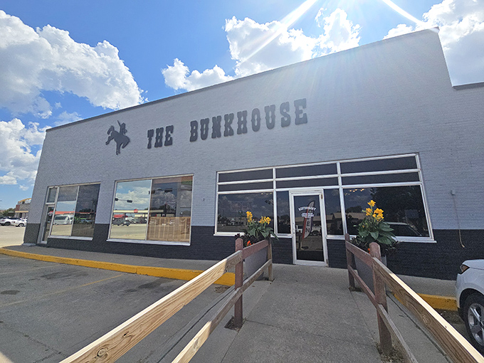 The Bunkhouse welcomes visitors with a classic Western silhouette and sunflowers that seem to nod "howdy" as you approach.