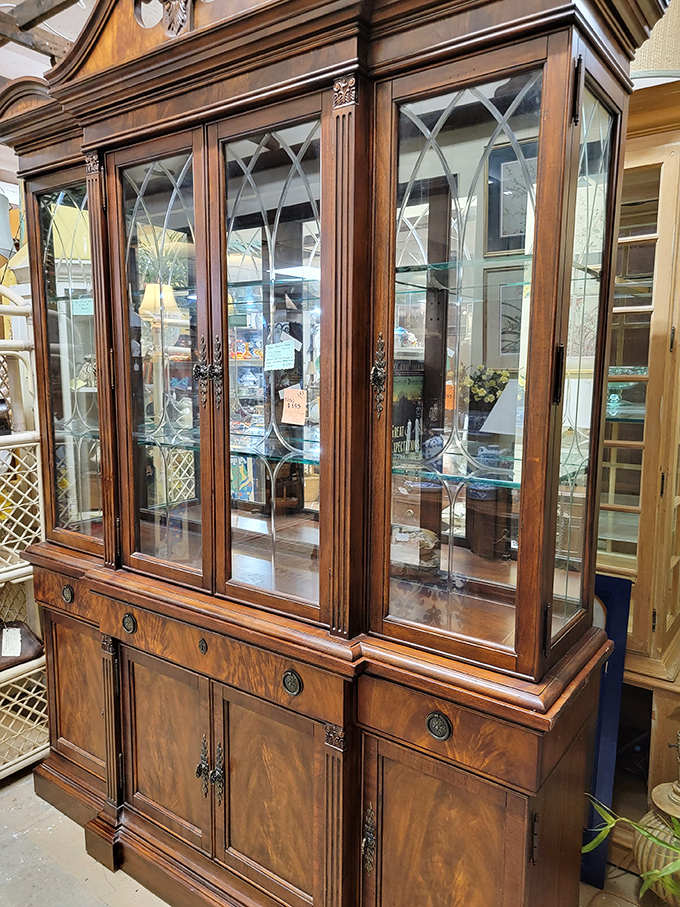 This mahogany china cabinet with diamond-paned glass doors has likely displayed wedding crystal for generations. Imagine the dinner parties it's witnessed!