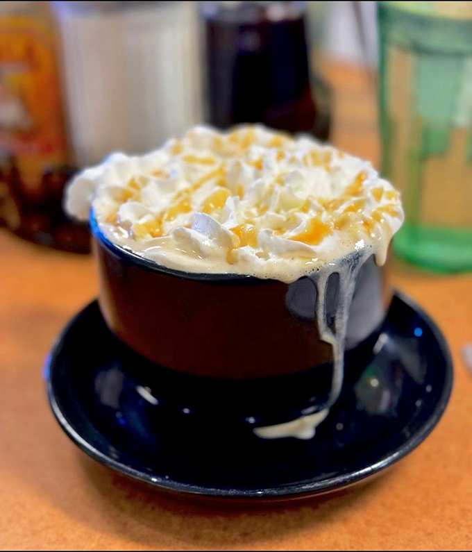 That caramel latte isn't just topped with whipped cream – it's wearing a cloud crown fit for breakfast royalty.
