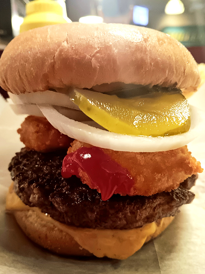 Some call this burger excess; to others, it&rsquo;s architecture&mdash;a meticulously stacked masterpiece of beef, cheese, pickles, and onions.