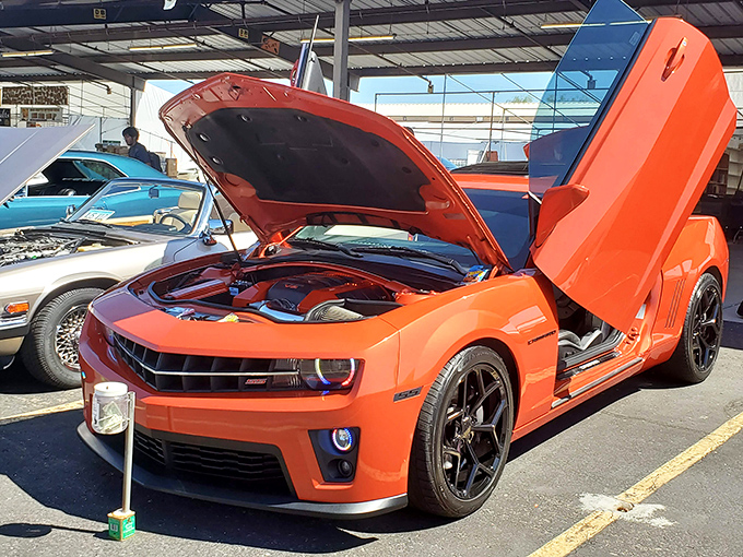 Car show surprise! Between the handcrafted jewelry and homemade salsa, you might stumble upon this gleaming Camaro with doors that open like it's ready for takeoff.