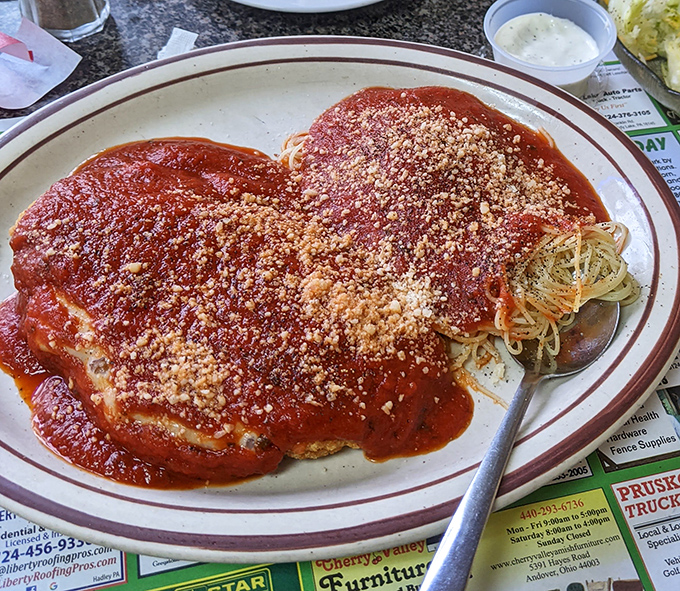 Their chicken parmesan doesn't mess around&mdash;a plate-filling portion of breaded chicken beneath a lava flow of marinara and melted cheese that means business.